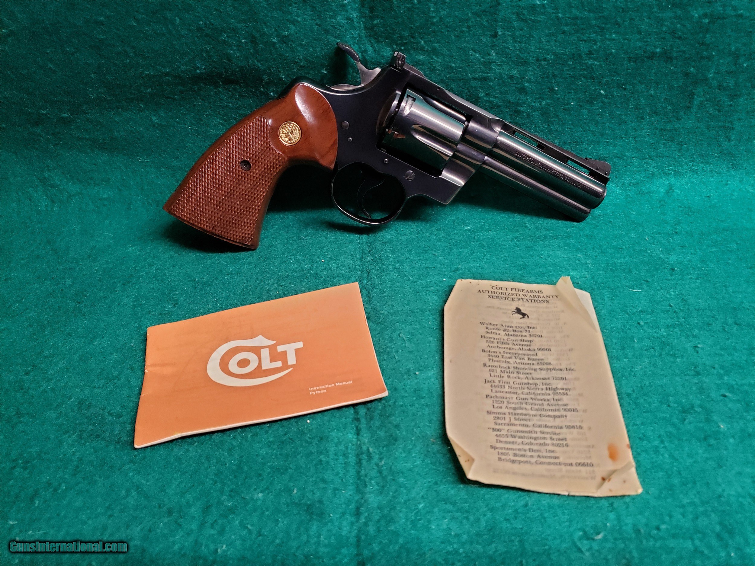 COLT PYTHON - BLUED. 4 INCH BARREL. ORIGINAL GRIPS. W-OWNERS MANUAL ...